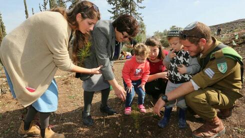 Sea of green: Israelis plant trees to celebrate Jewish holiday Tu Bishvat