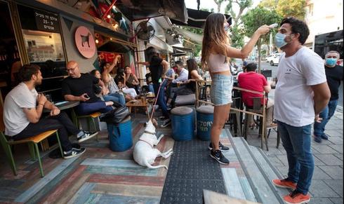 Tel Aviv has spring in its step again, but businesses face new costs