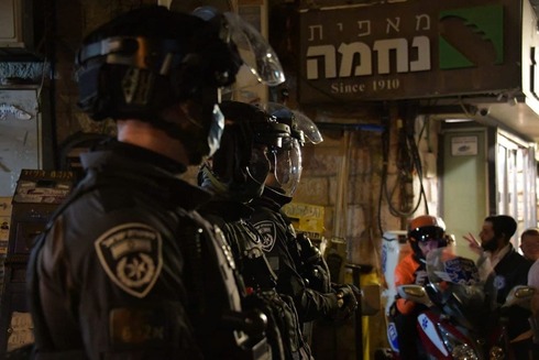 Jerusalem police clash with Haredi rioters over dangerously built Sukkah