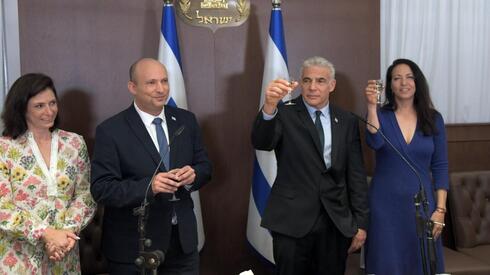 'Good luck my brother,' Bennett tells Lapid as he hands over the ...